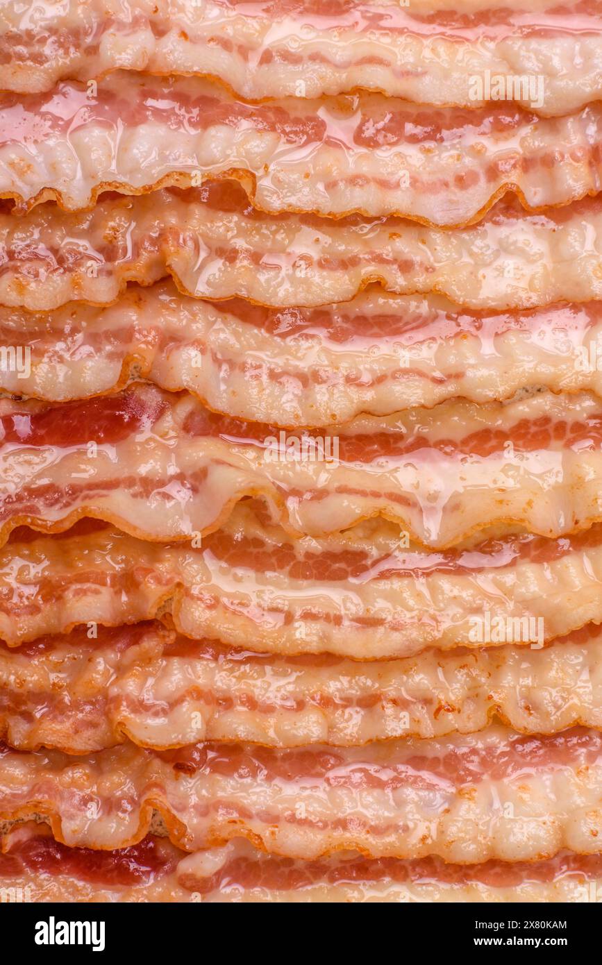 Delicious bacon in the form of slices with salt, spices and herbs on a ...