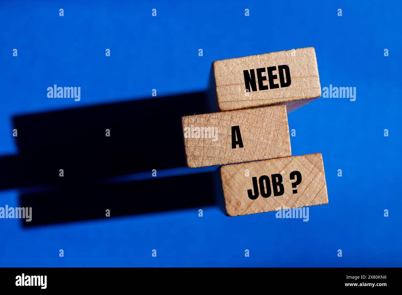 Need a job ? words written on wooden blocks with blue background ...