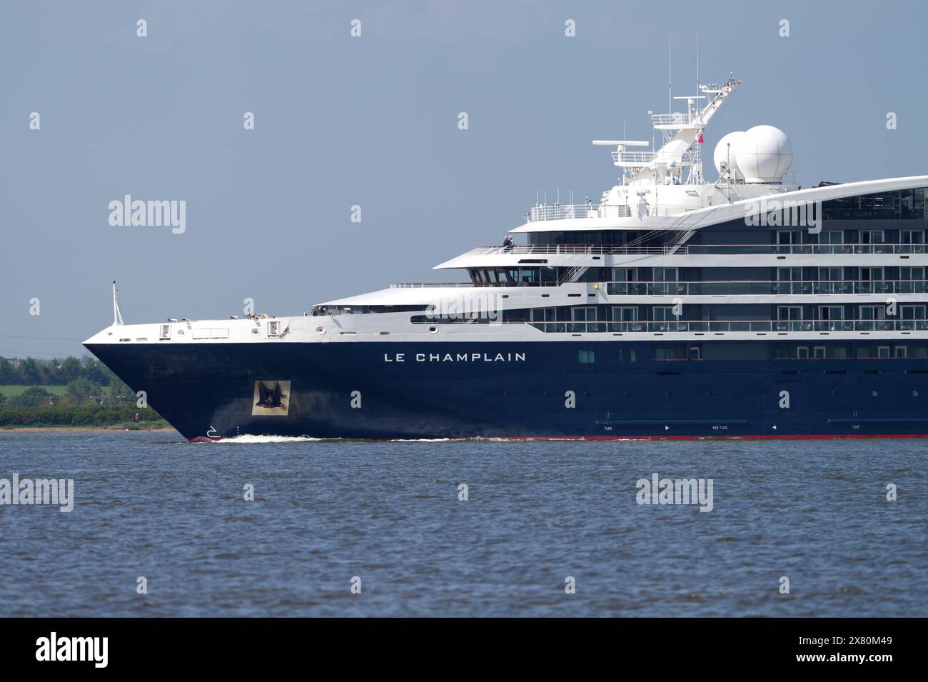 The ultra luxury cruise ship Le Champlain cruising the Thames near Cliffe in Kent on her way to ...