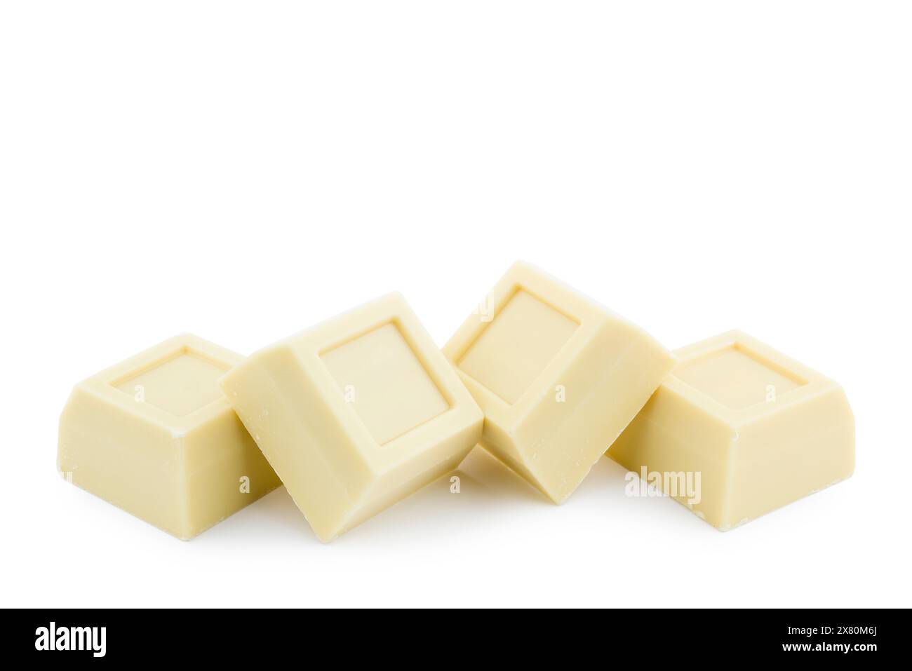 White chocolate blocks on white background Stock Photo - Alamy