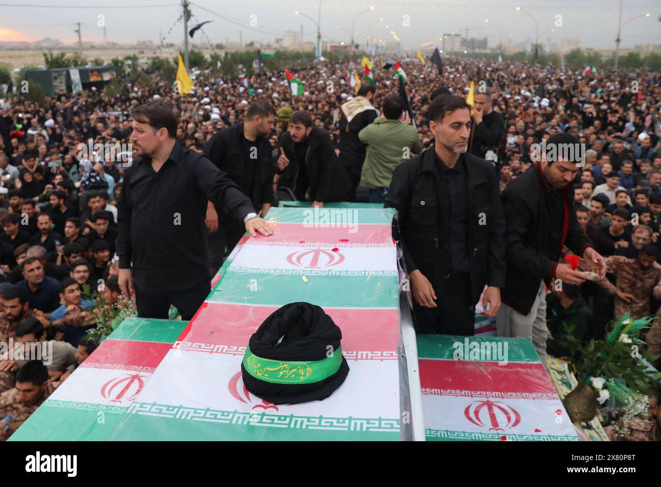 May 22, 2024, Qom, Iran: Iranian mourners attend the funeral procession ...