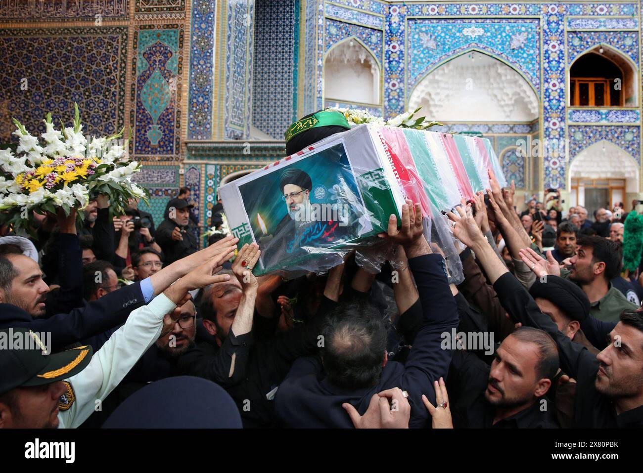 May 22, 2024, Qom, Iran: Iranian mourners attend the funeral procession ...