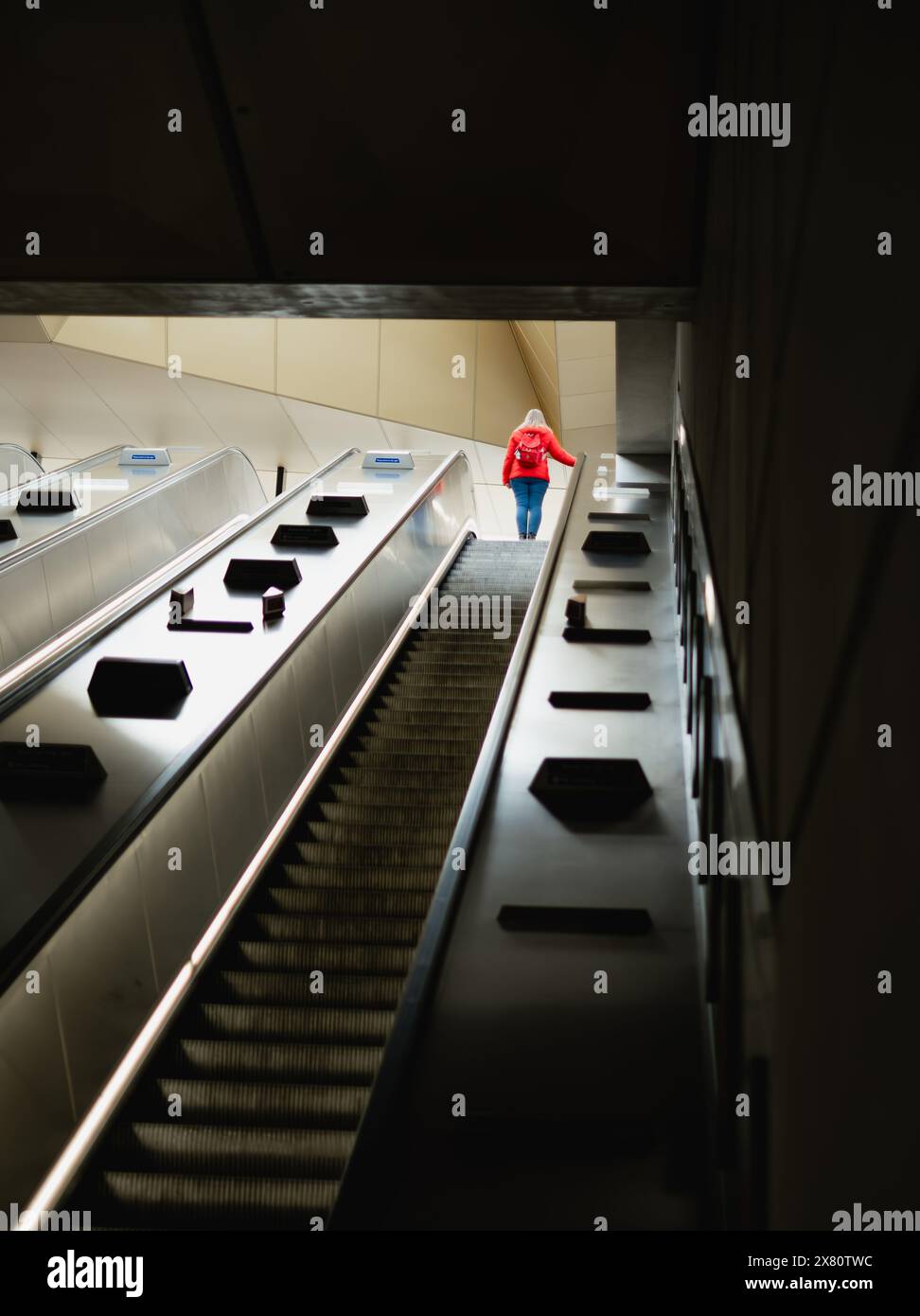 One person travelling on elevator and nearing the top. No other people ...