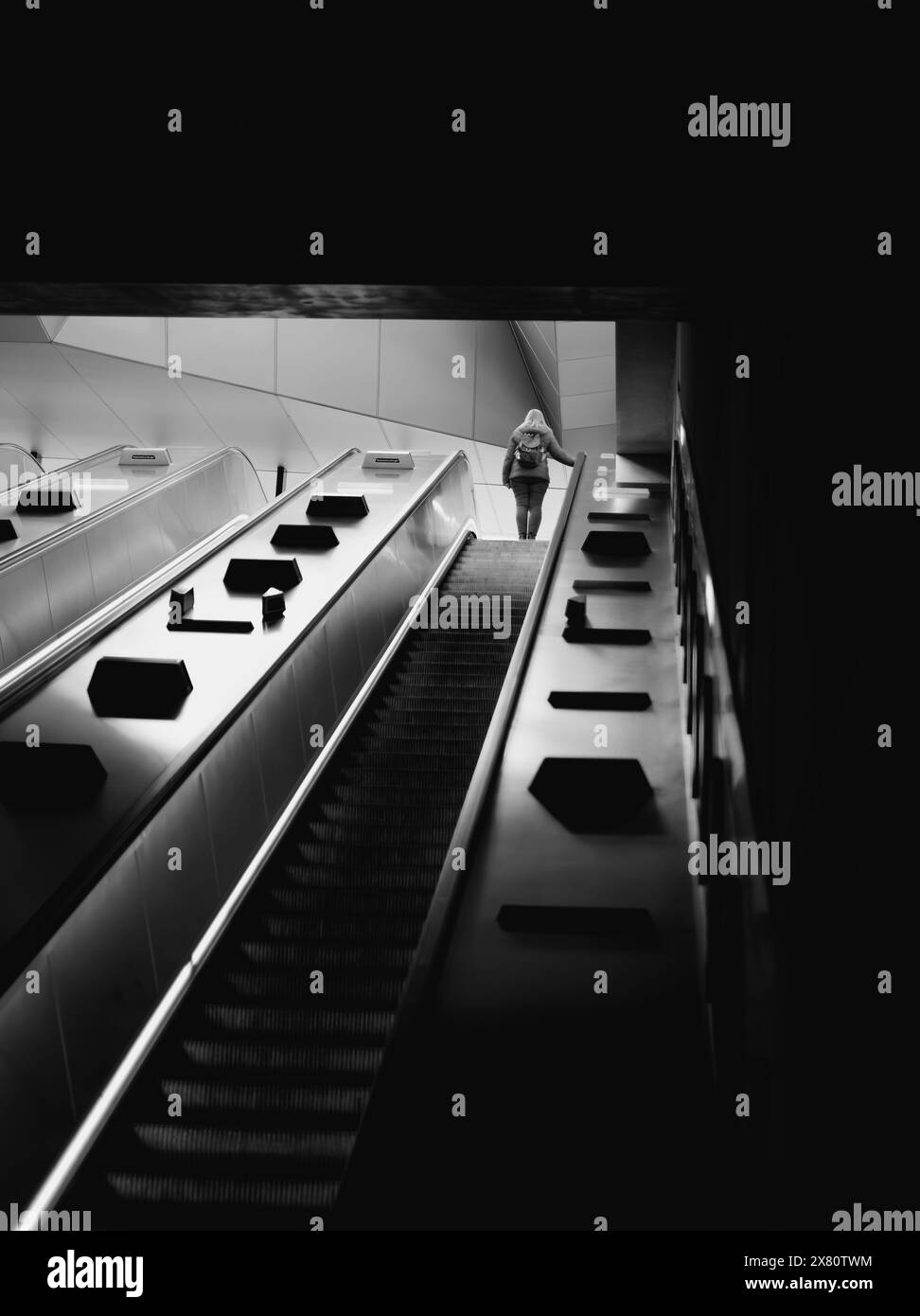 One person travelling on elevator and nearing the top. No other people ...