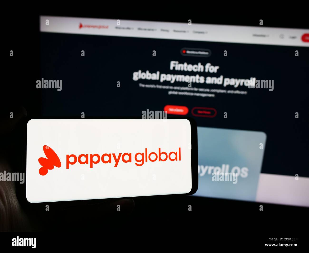 Person holding mobile phone with logo of Israeli payments platform ...