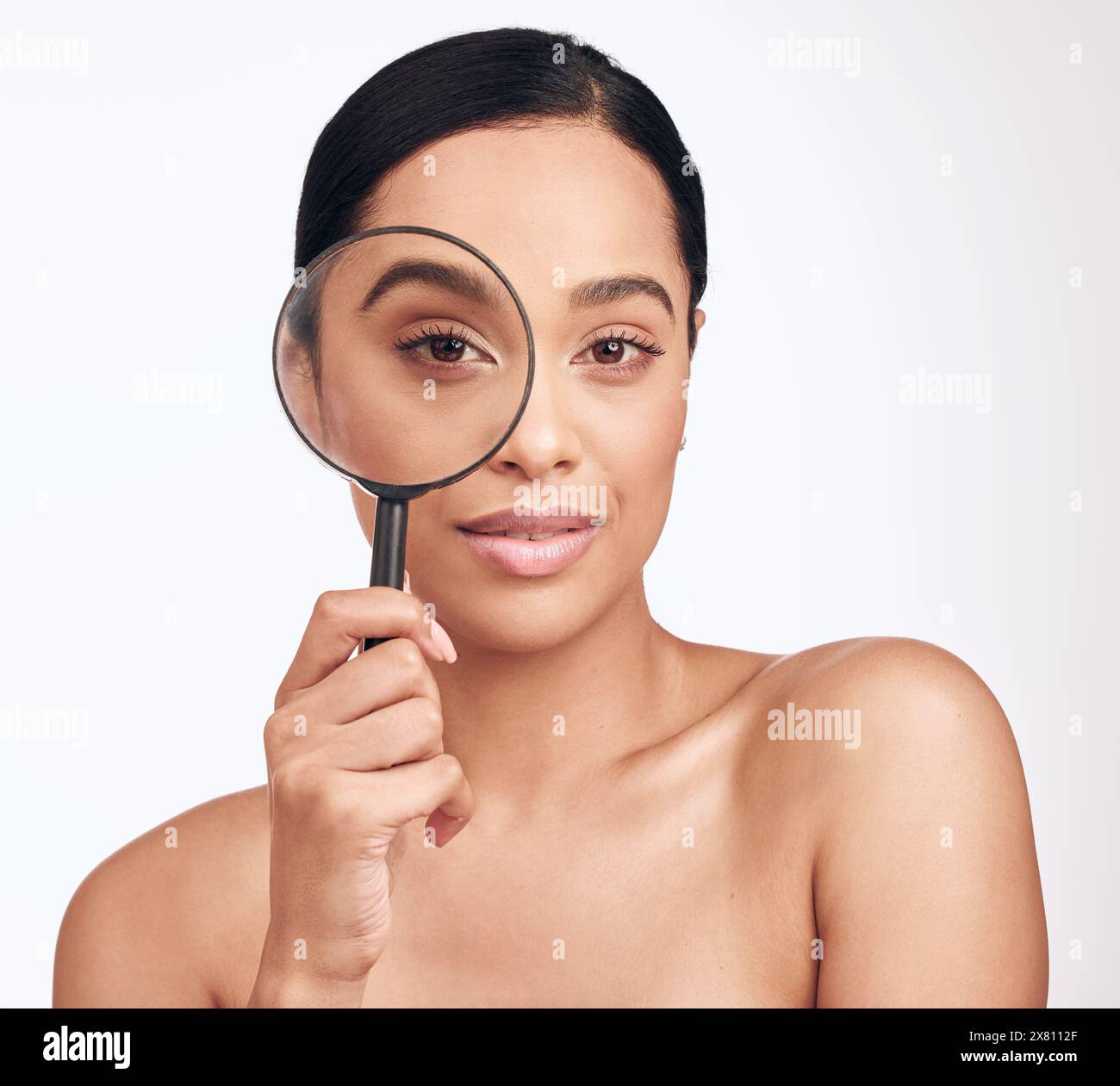 Magnifying glass, portrait and skincare with natural woman in studio ...