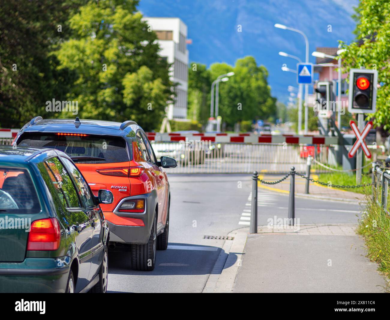 Schaan, Liechtenstein - May 17, 2024: A suburban scene with cars ...