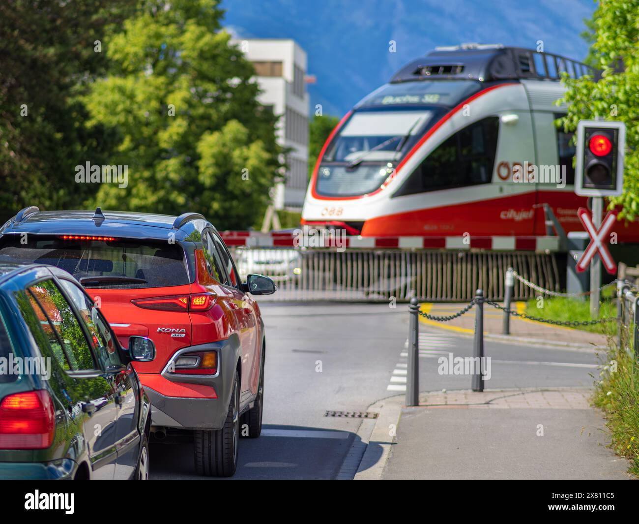 Schaan, Liechtenstein - May 17, 2024: A suburban scene with cars ...