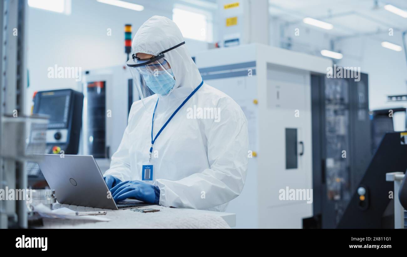 Scientist in coverall equipment typing hi-res stock photography and ...