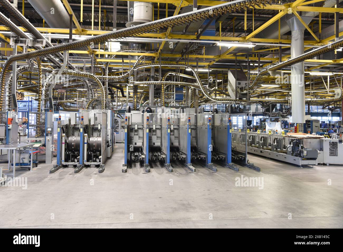 modern machines for transportation in a large print shop for production ...