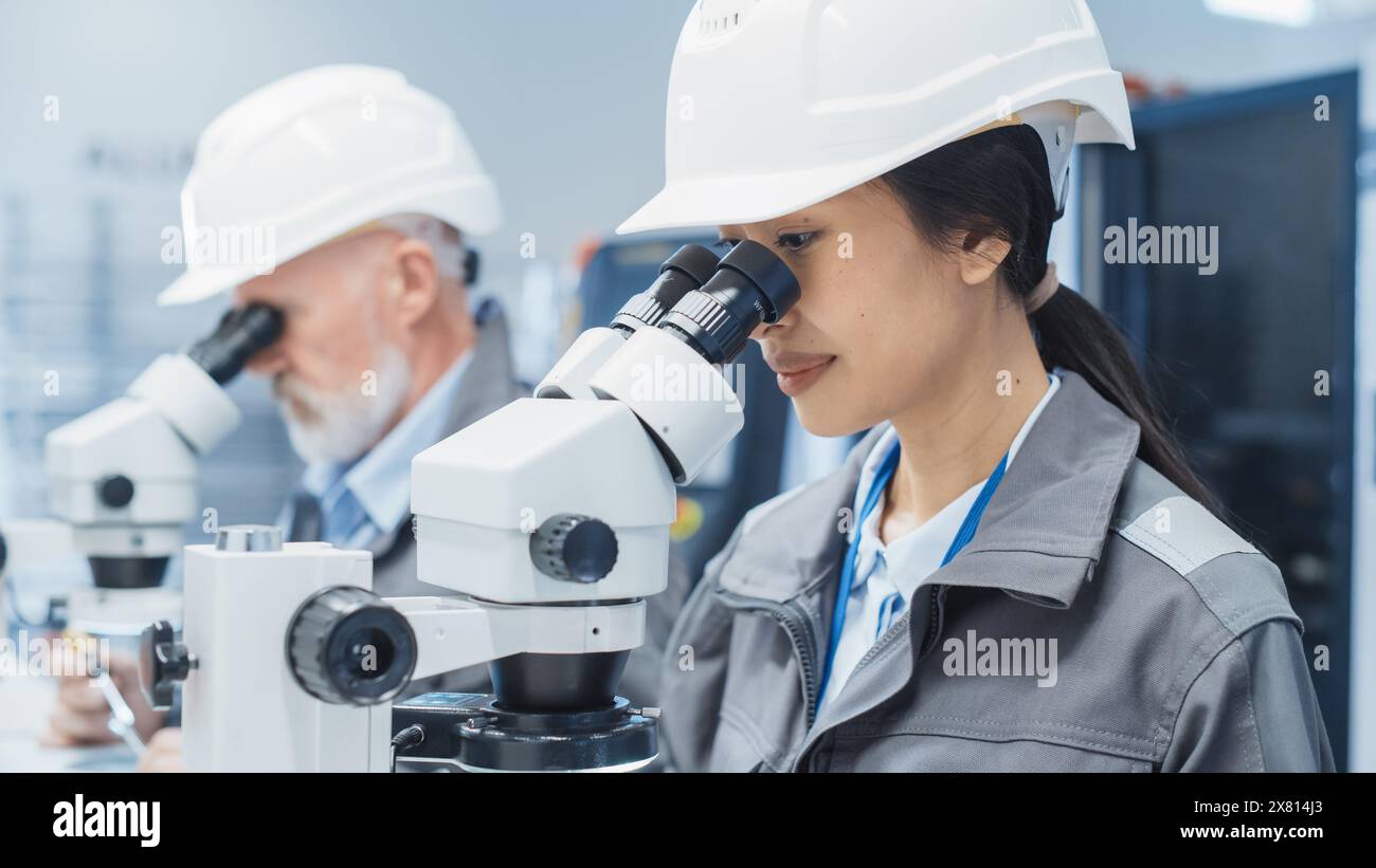 Portrait of a Young Asian Industrial Scientist and Older Engineer ...