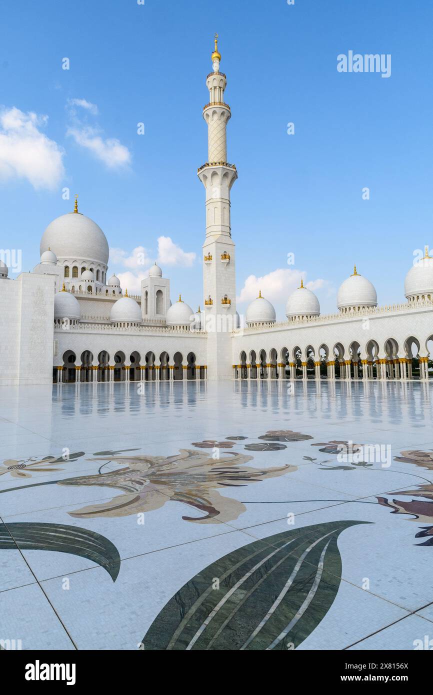 The majestic Sheikh Zayed Mosque under a clear blue sky, reflecting its ...