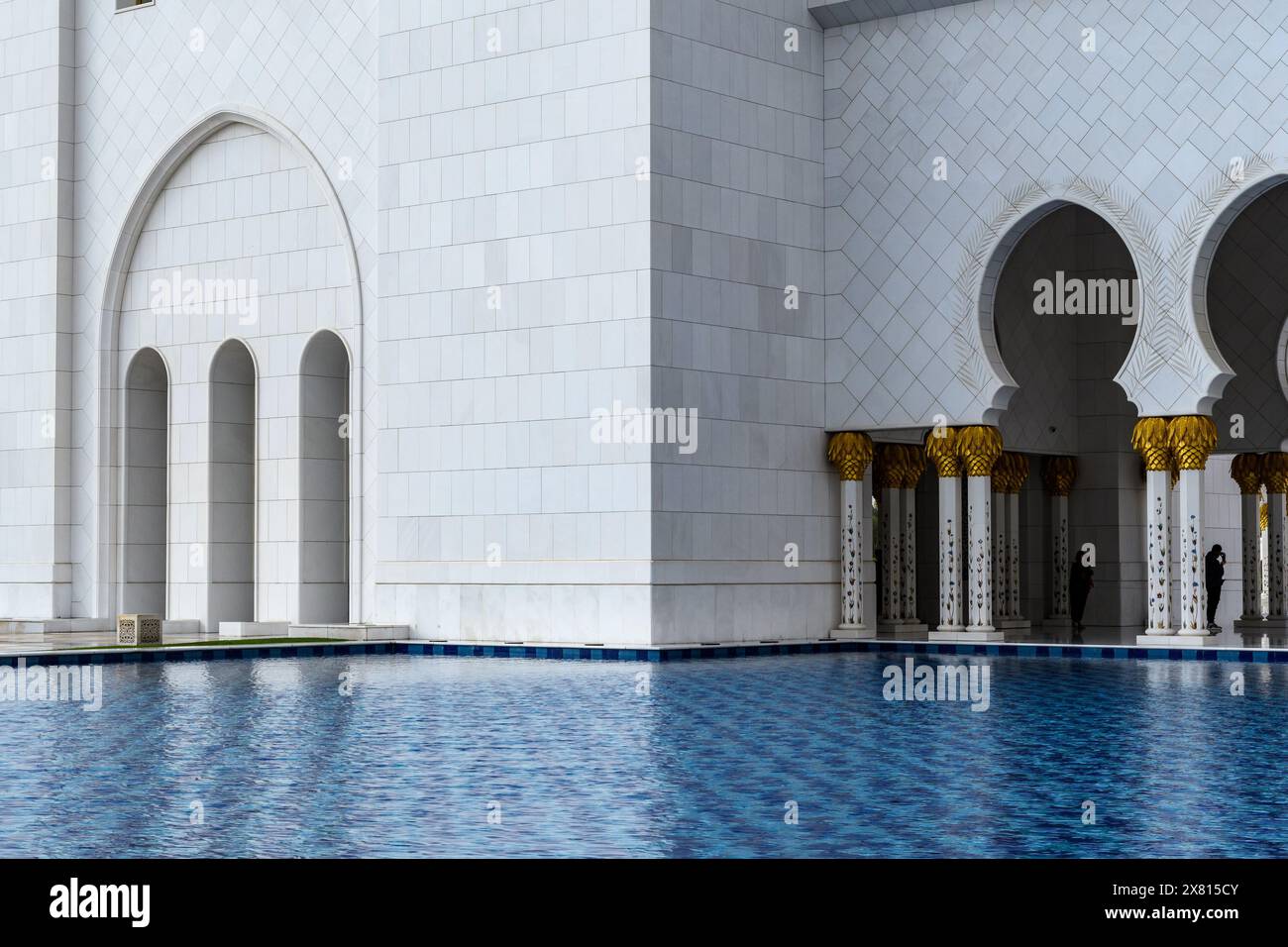 Elegant arches and reflective waters at the Sheikh Zayed Grand Mosque ...