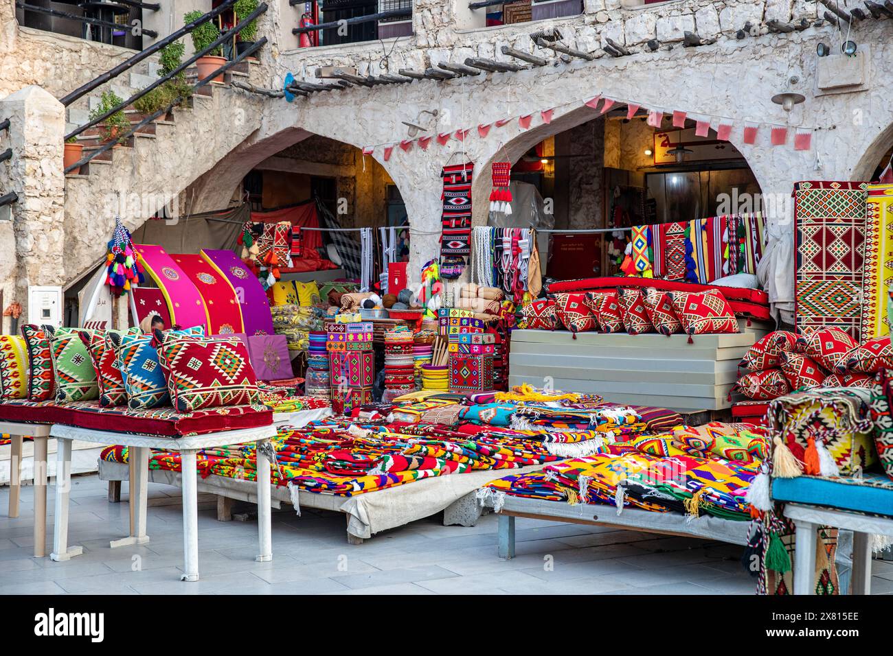 Qatar, Doha, Bright colours of carpets outside the Souq Stock Photo - Alamy