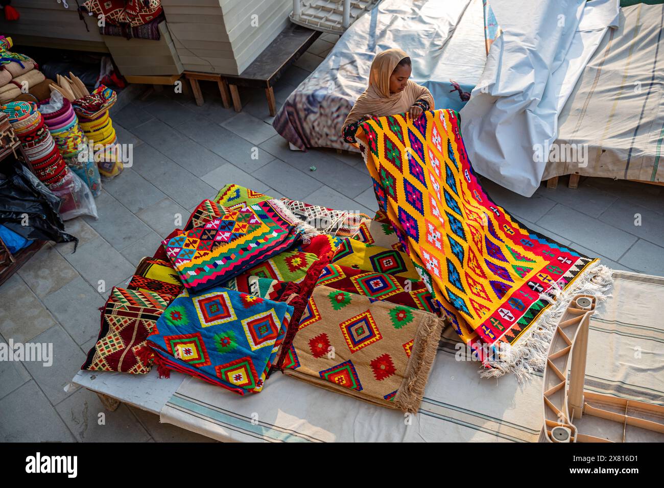 Qatar, Doha, Bright colours of carpets outside the Souq Stock Photo - Alamy