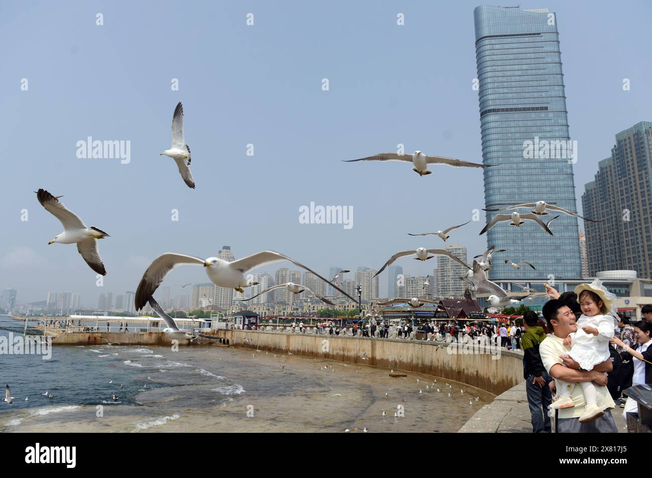 Dalian, China's Liaoning Province. 22nd May, 2024. Tourists have fun at ...