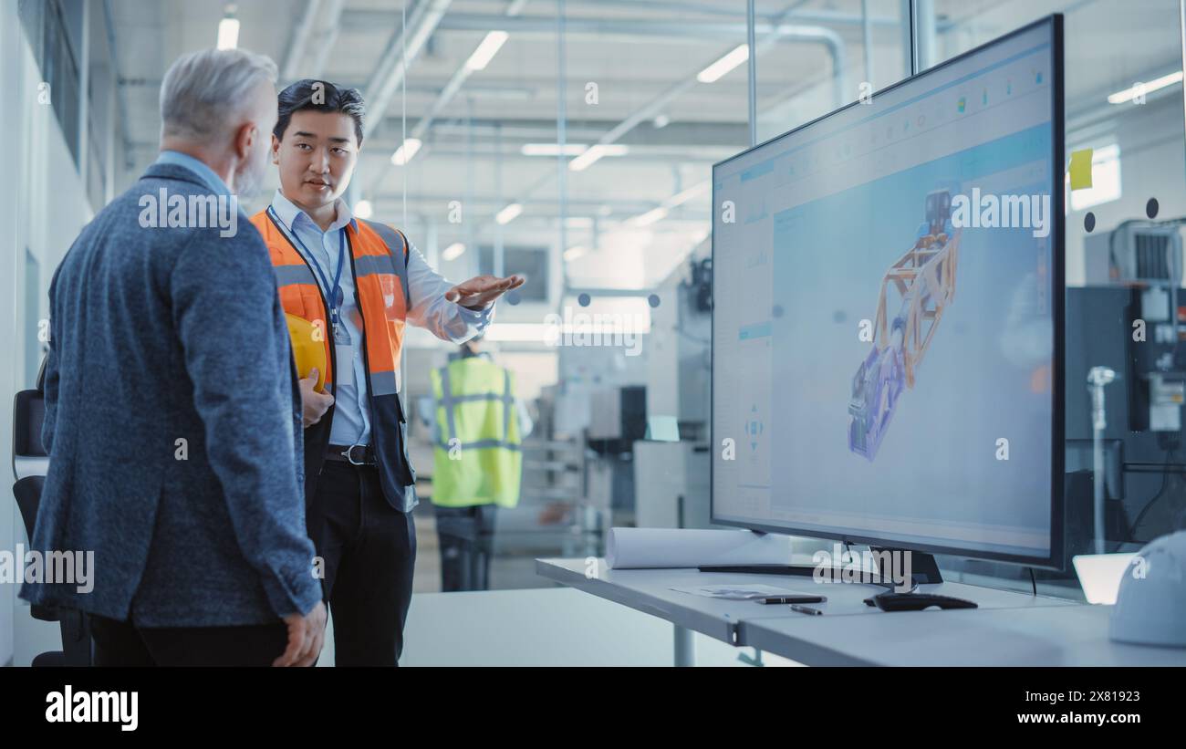 Factory Office Meeting: Rack Focus from Worker to Engineer Talking with ...