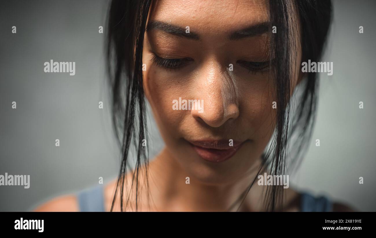 Extreme Close Up of the Face of a Asian Female Looking Down. Strong ...