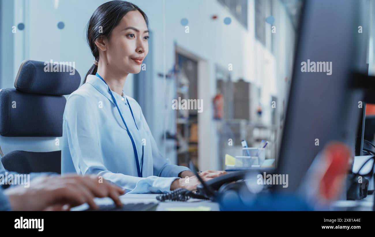 Portrait of an Asian Industrial Engineer Developing Models of a Heavy ...
