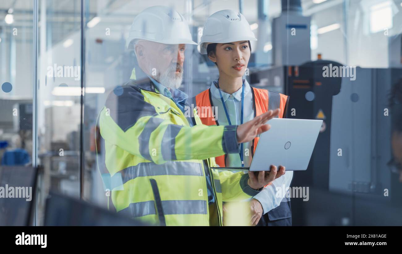 Asian Quality Control Specialist Conducting an Industrial Facility ...