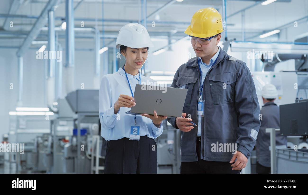 Multiethnic engineers discussing work process hi-res stock photography ...