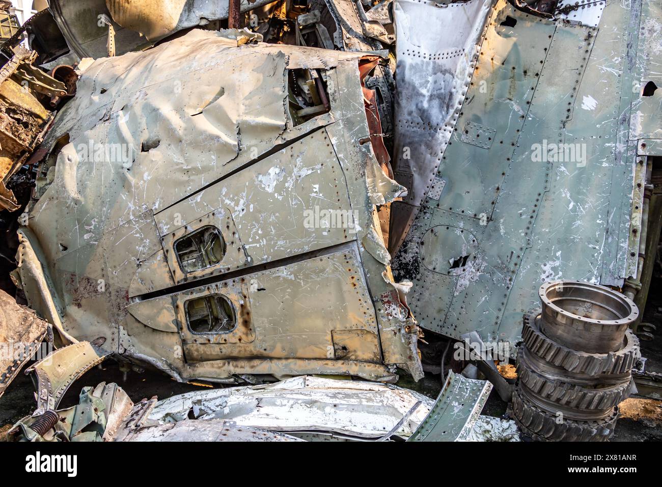 A pile of steel parts from the fuselage and wings of a damaged aircraft ...