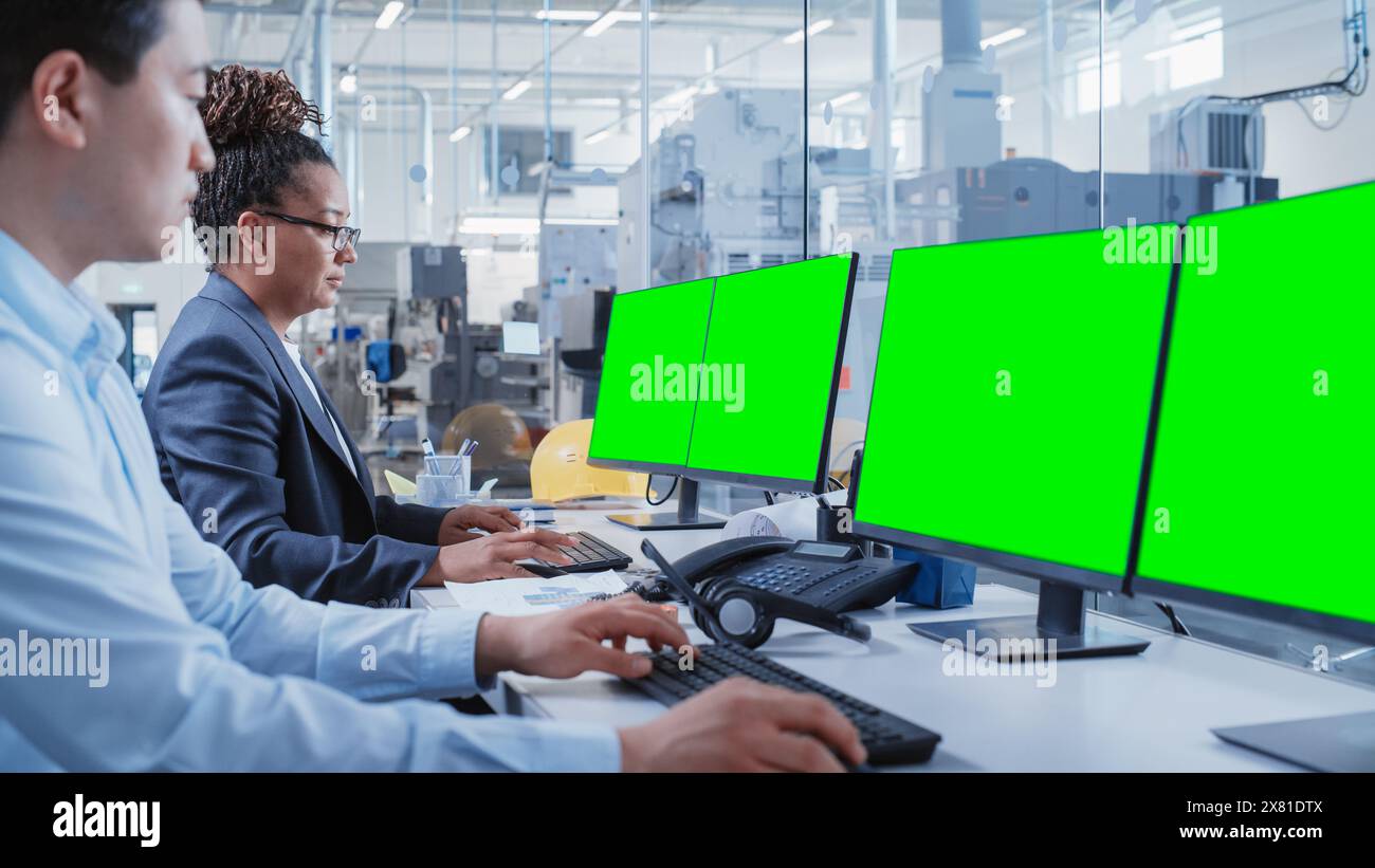 Factory Office Facility: Industrial Engineers Drafting Blueprints of a ...