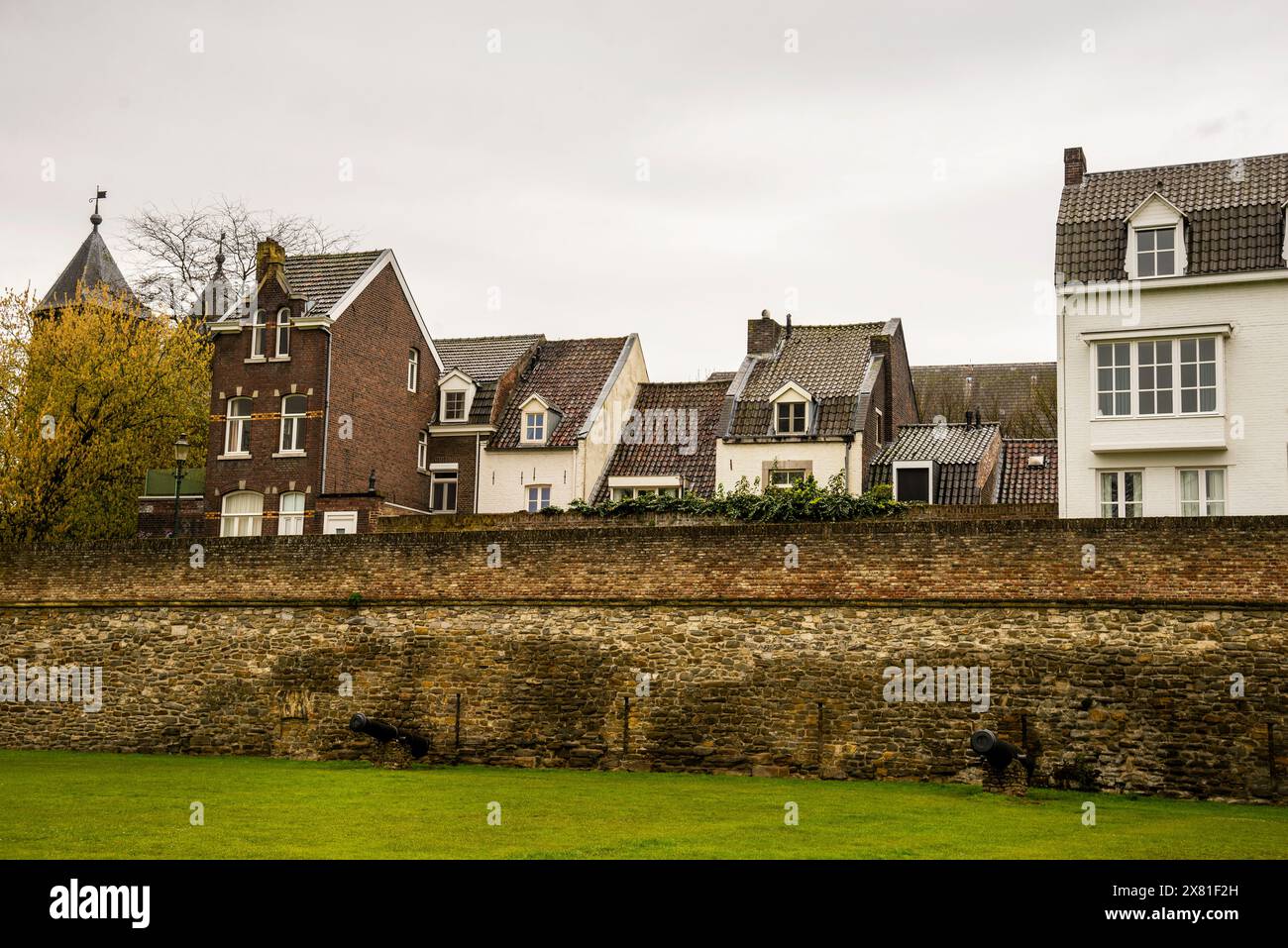 Medieval city wall and Dutch gable with recessed windows, Maastricht ...