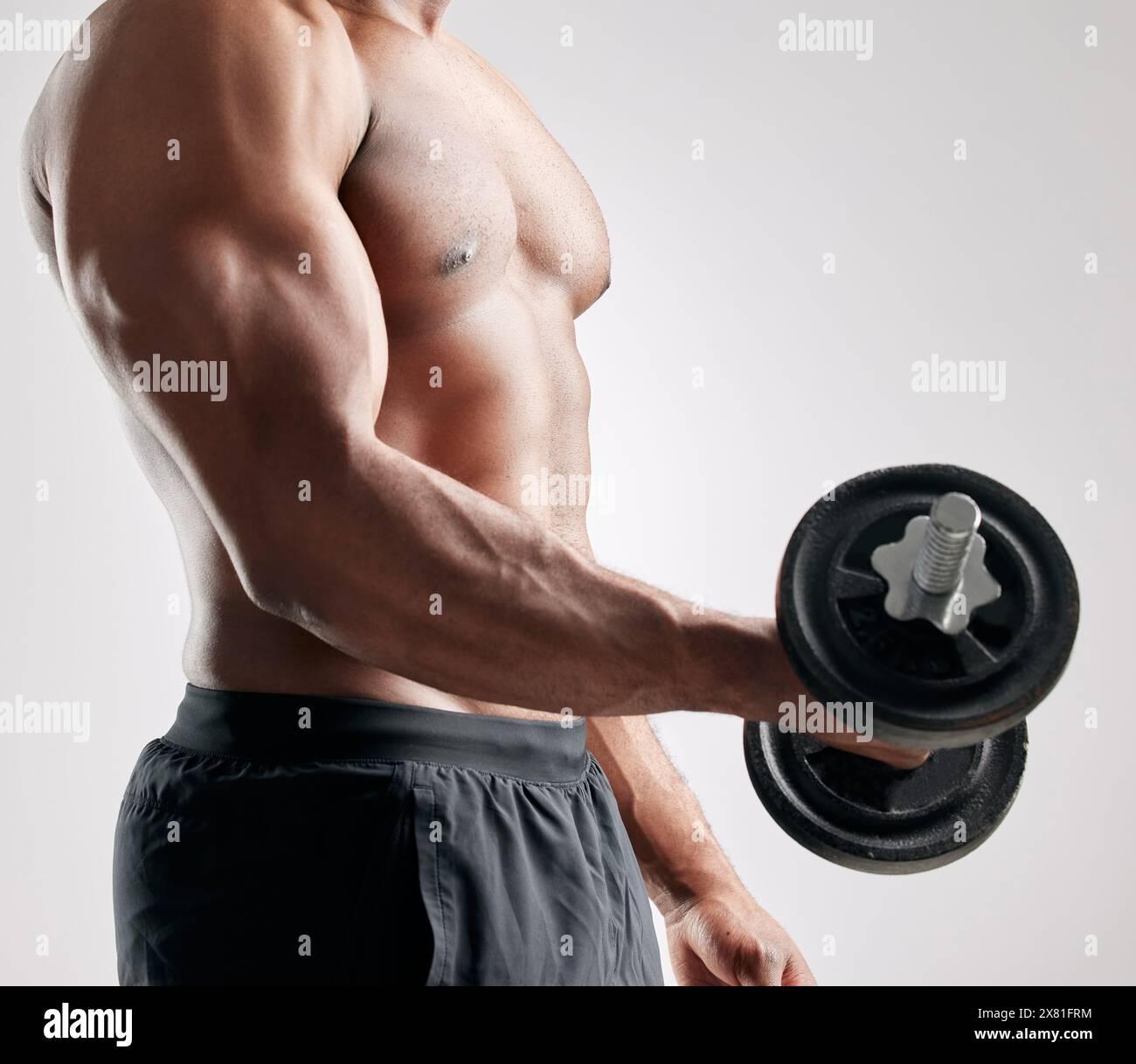 Body, man and dumbbell in studio with muscles, bodybuilder and exercise ...