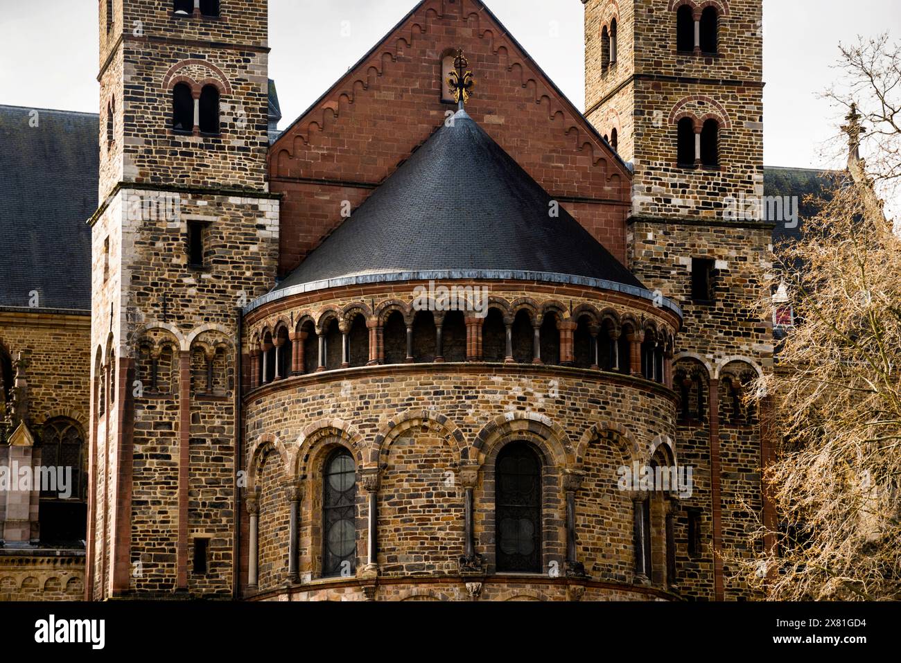Curved brick apse and towers of Romanesque St Servatius Basilica ...