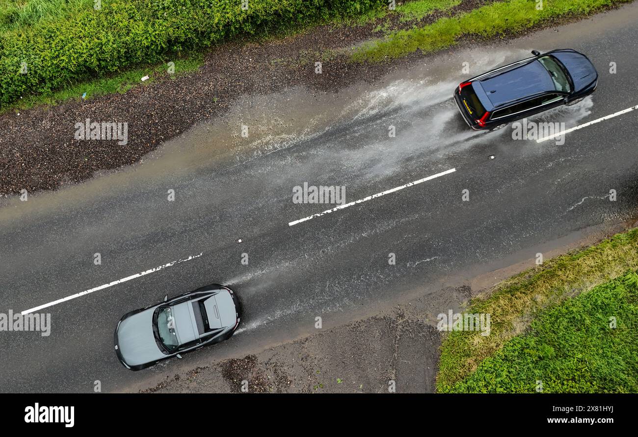 Cars pass in flooding hi-res stock photography and images - Alamy