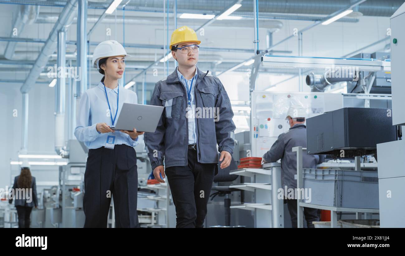 Multiethnic engineers discussing work process hi-res stock photography ...