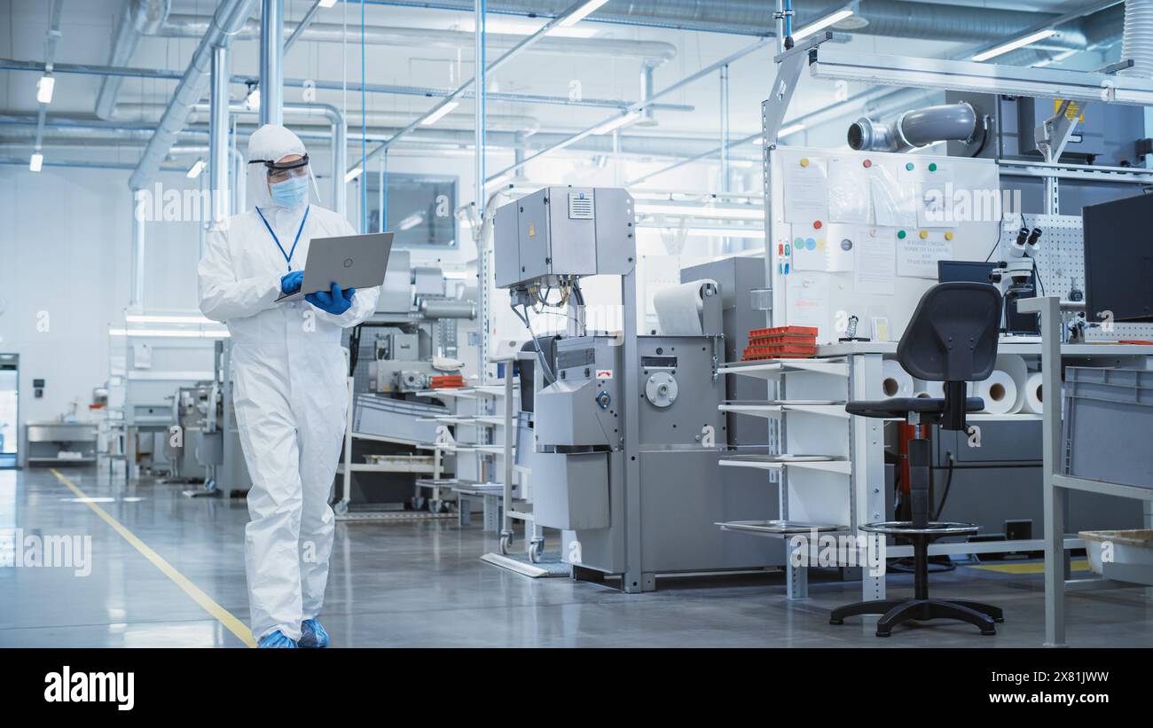 Heavy Industry Manufacturing Factory: Scientist in Sterile Coverall ...
