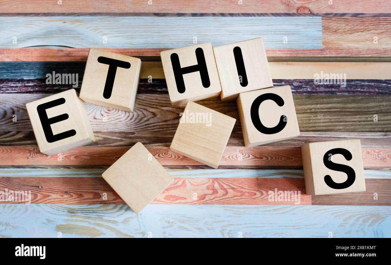Ethics word written in a wooden cube on a vintage background Stock ...