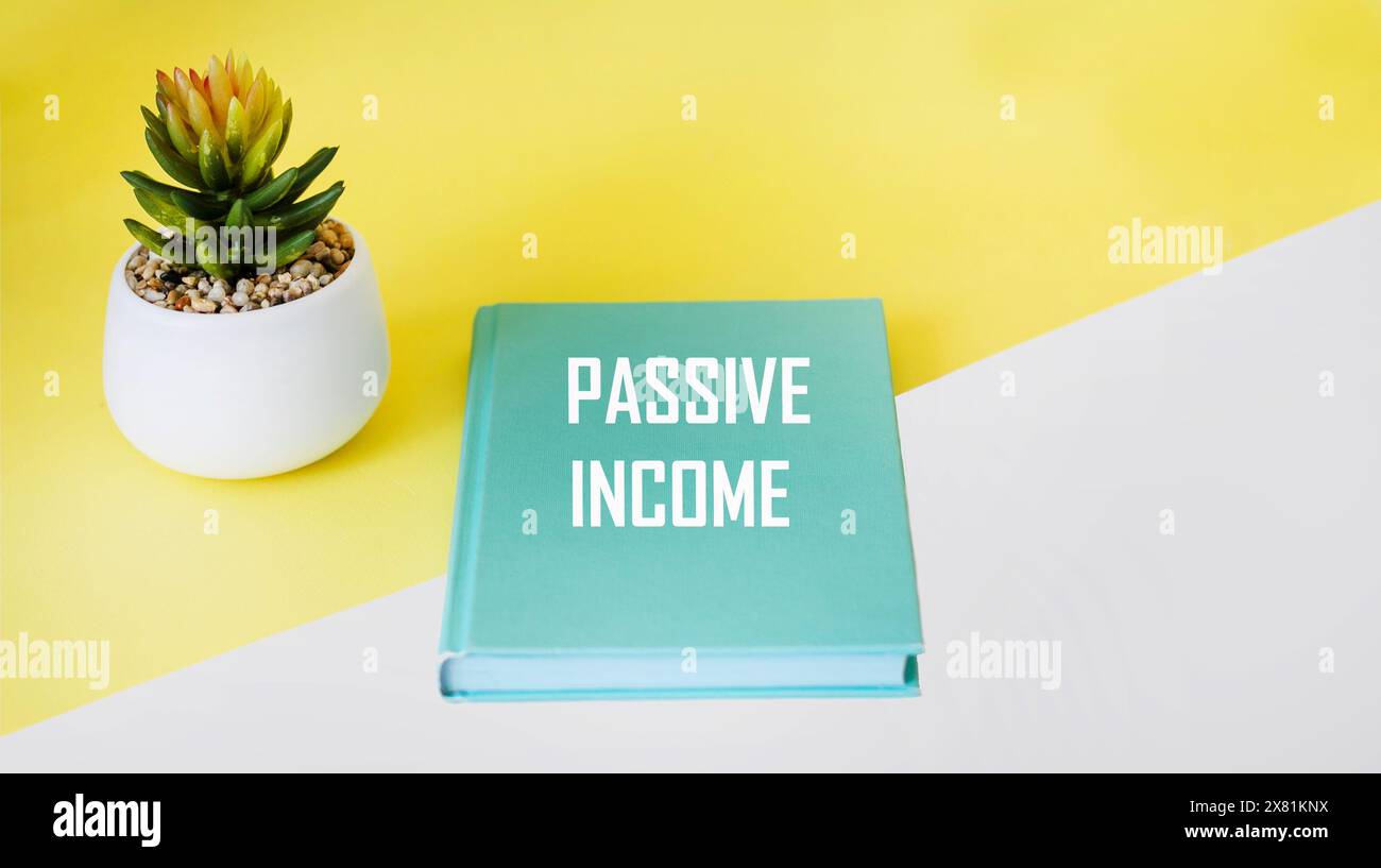 Green notepad with passive income text on a yellow and white background ...