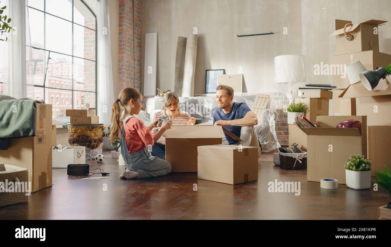 Happy Homeowners Moving In: Lovely Couple Sitting on the Floor of Cozy ...
