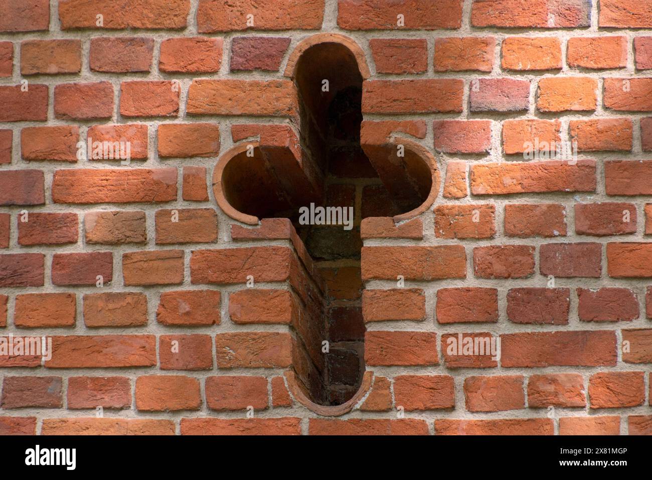 Cross on a brick wall. Details and elements of architecture Stock Photo ...