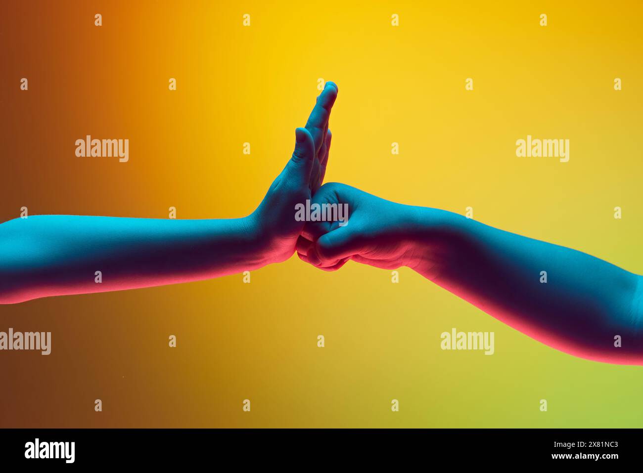 Child gesturing with hands against gradient green yellow background in ...