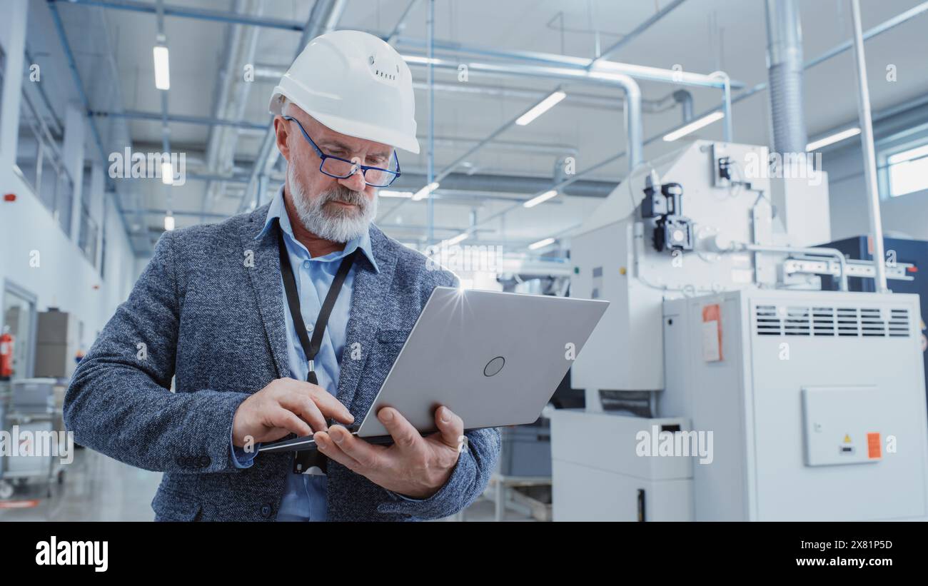 Portrait of a Bearded Middle Aged Chief Engineer Walking in a Factory ...