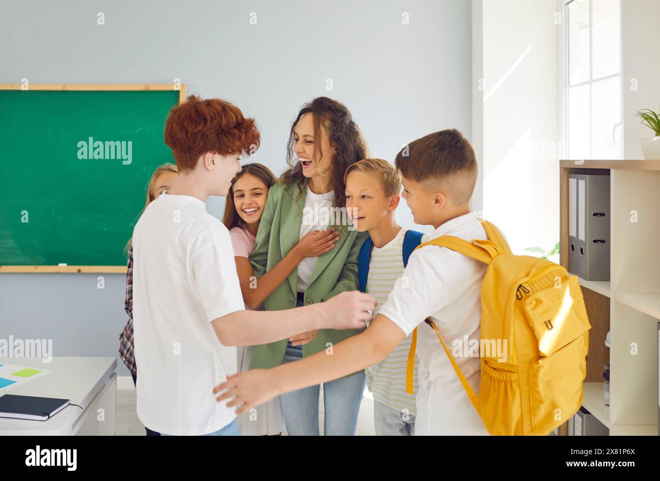 Teacher Spends Time With Students After Lesson At School Stock Photo ...