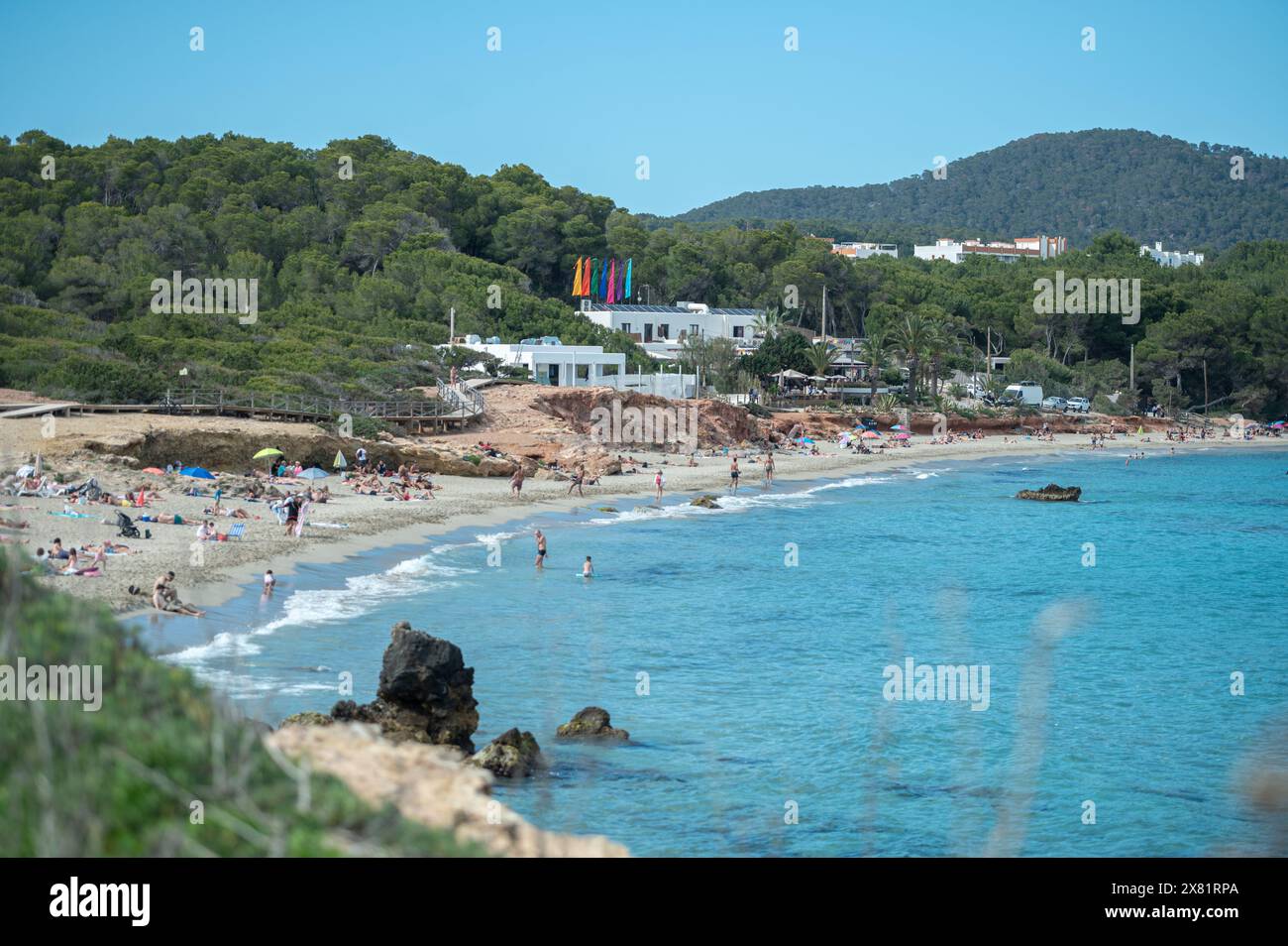 Panorama on the tourist beach of Cala Nova on the island of Ibiza in summer 2024 Stock Photo - Alamy