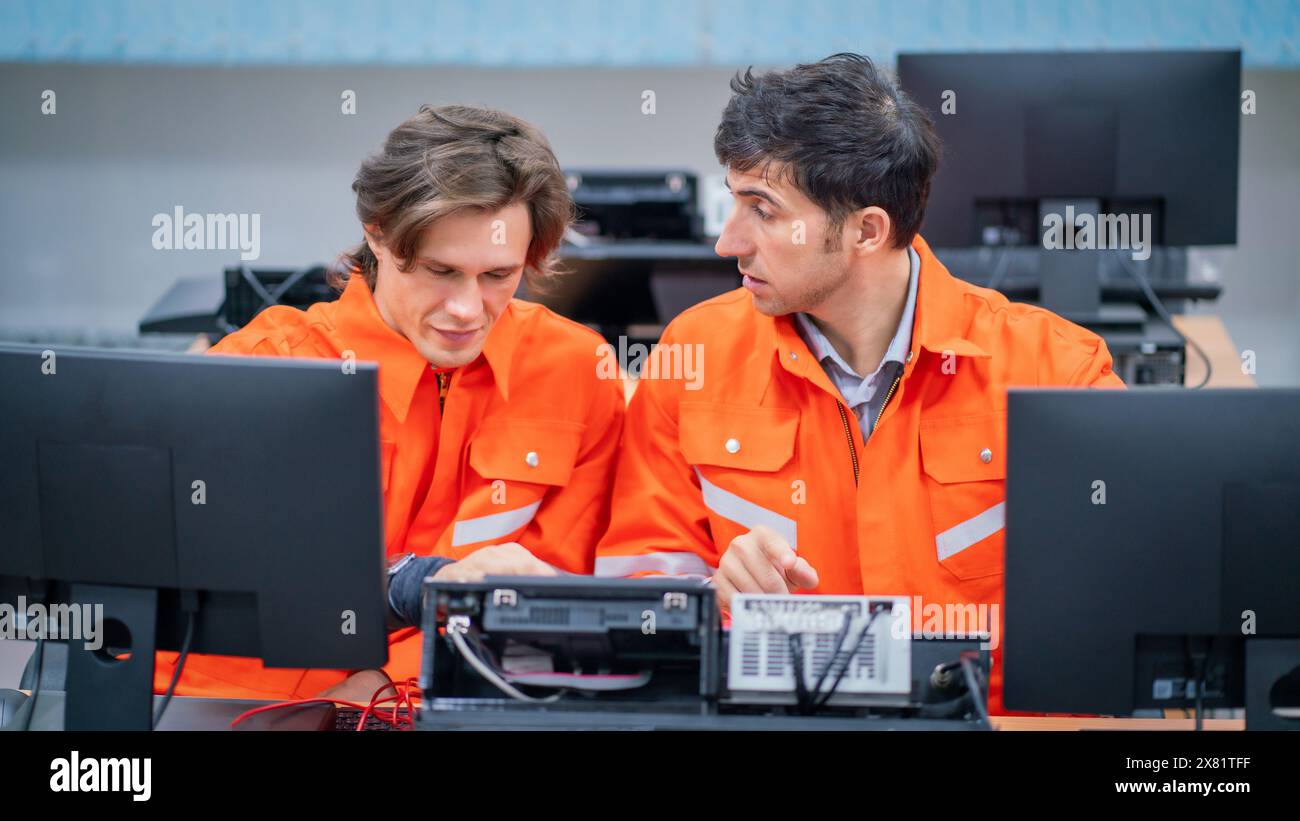 Mechanical engineering team working in robotic technology lap for research and develop for ...