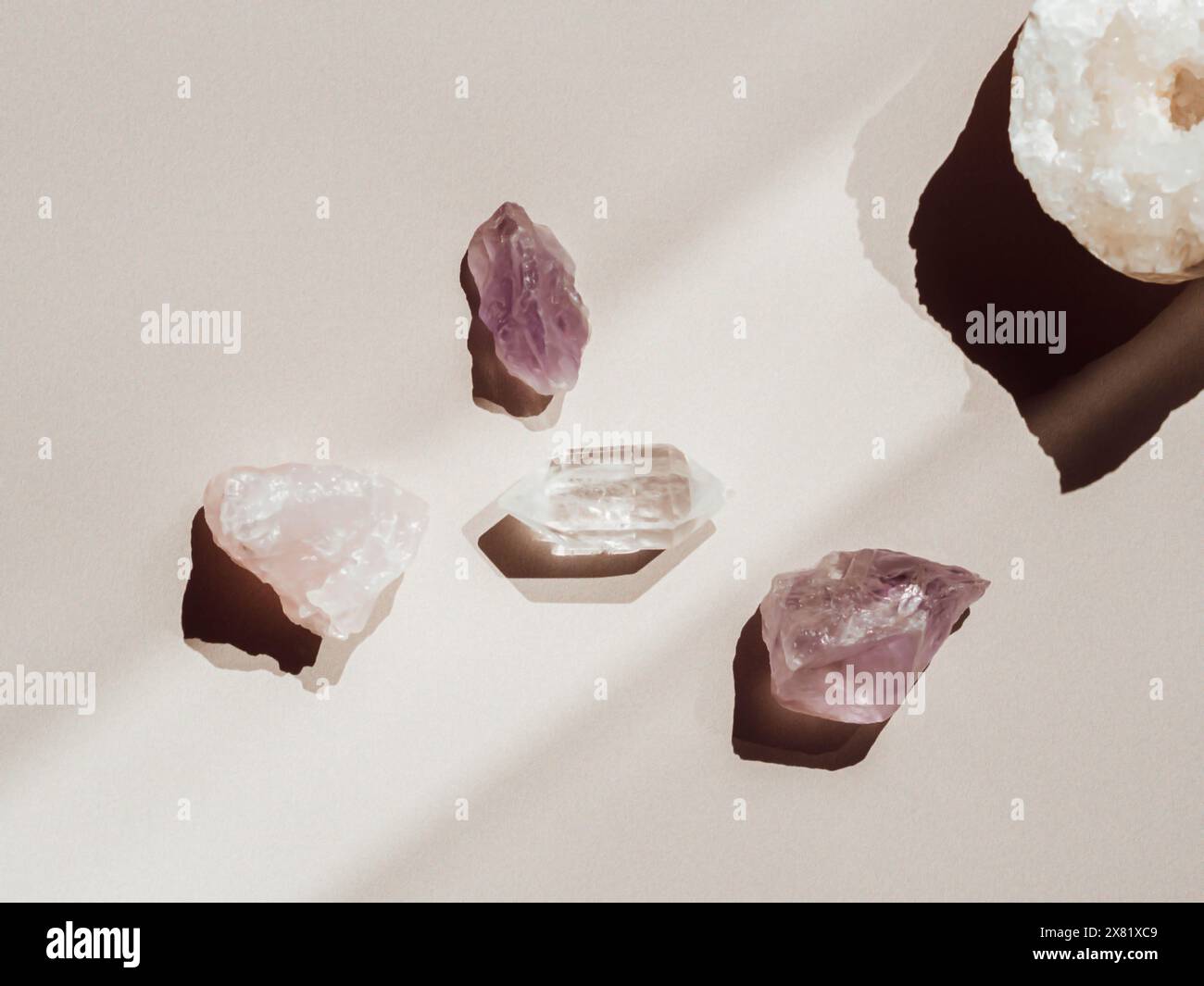 Collection of crystals quartz and amethyst on a beige background with ...