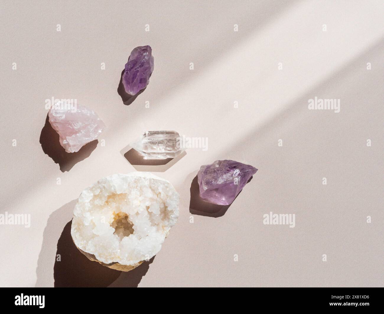 Collection of crystals quartz and amethyst on a beige background with ...