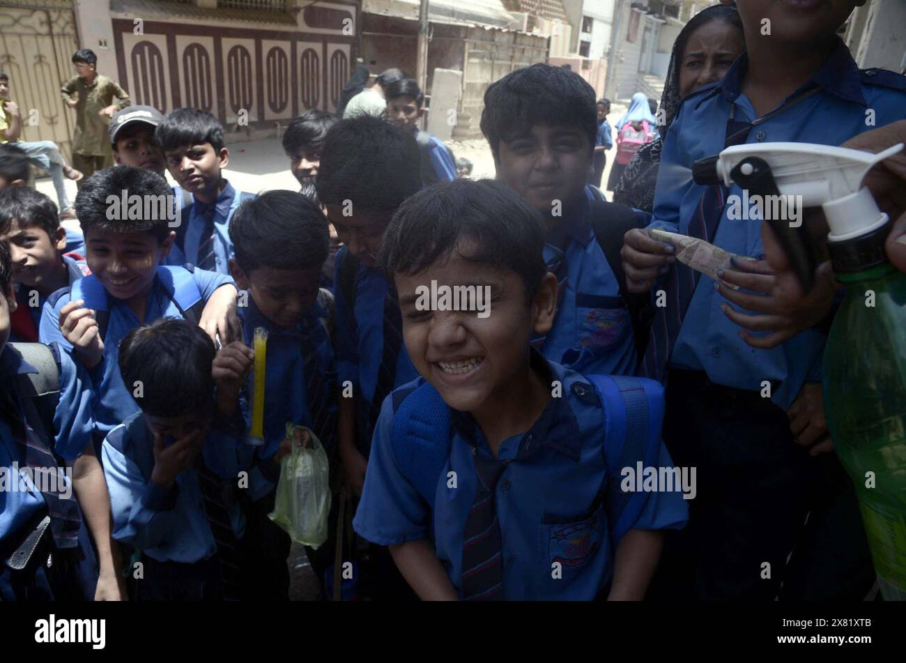 School students take showers to beat the heat during hot weather of ...
