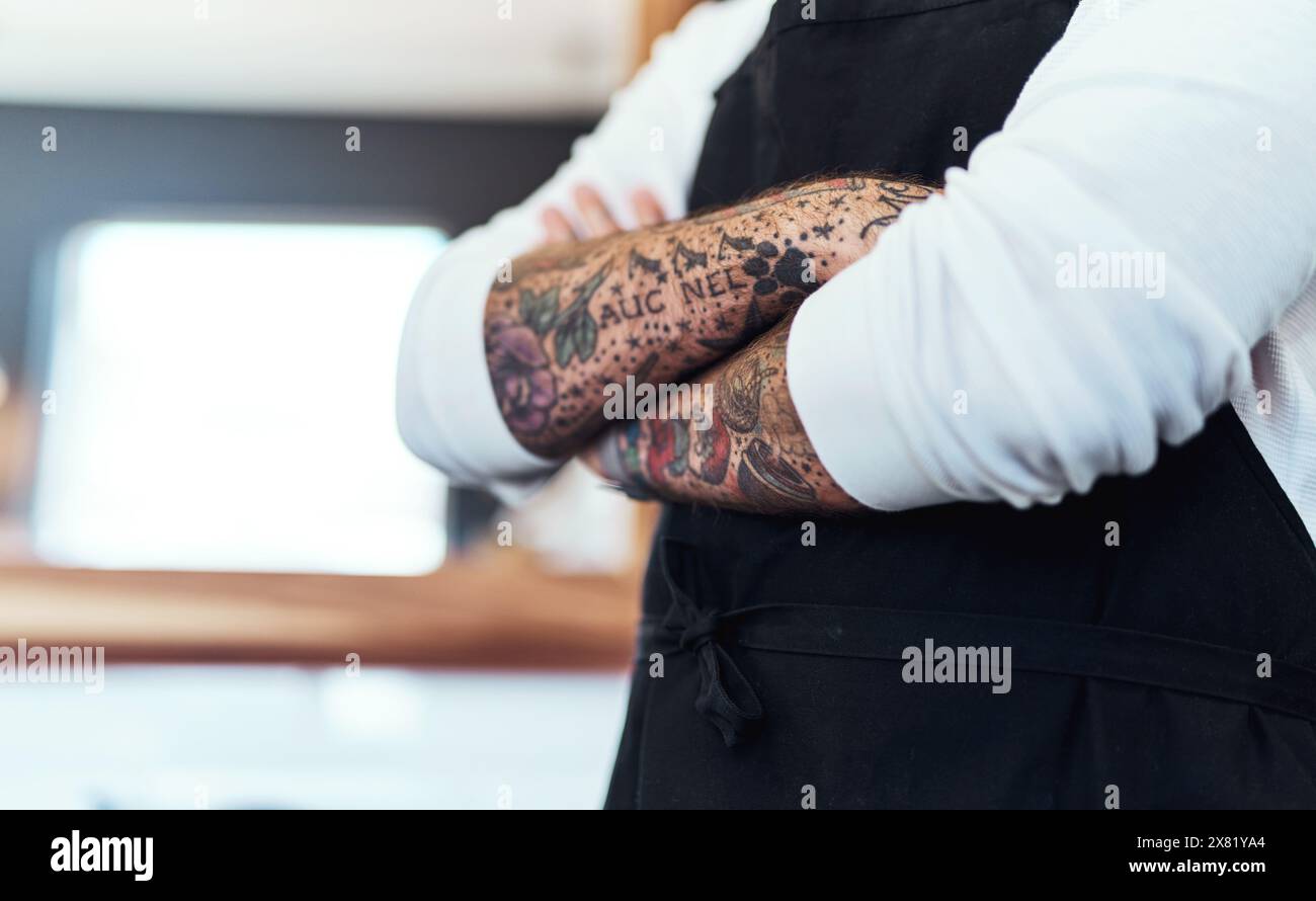 Tattoo, artist and art on skin from studio, parlor business owner with ...