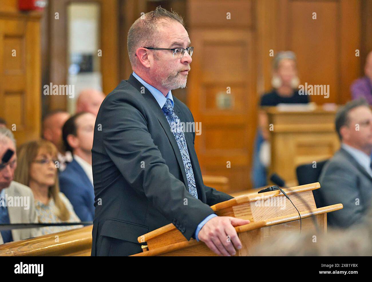 Assistant District Attorney Adam Lally questions witness Kerry Roberts ...