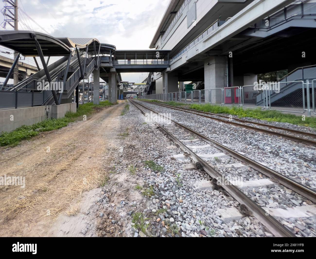 The old railroad tracks pass over the overpass of the suburban train ...