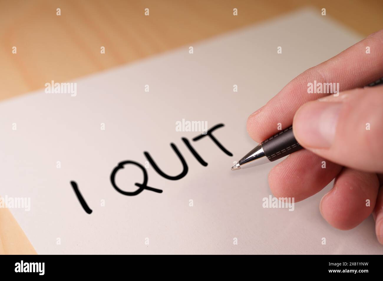 Hand Writing a resignation letter with the I QUIT. Great resignation ...