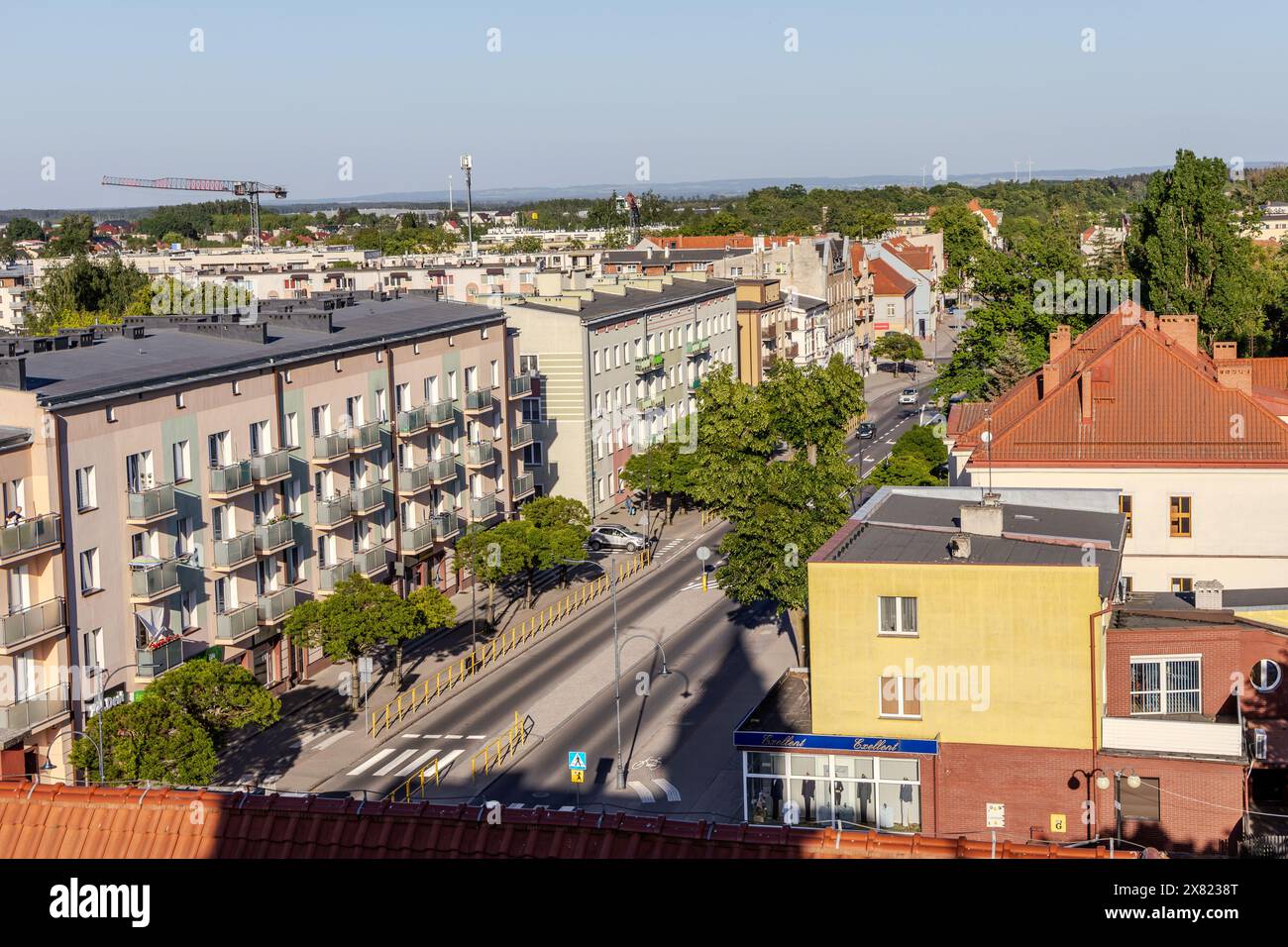 Aerial panoramic view of main street with buildings and roofs in Polish ...